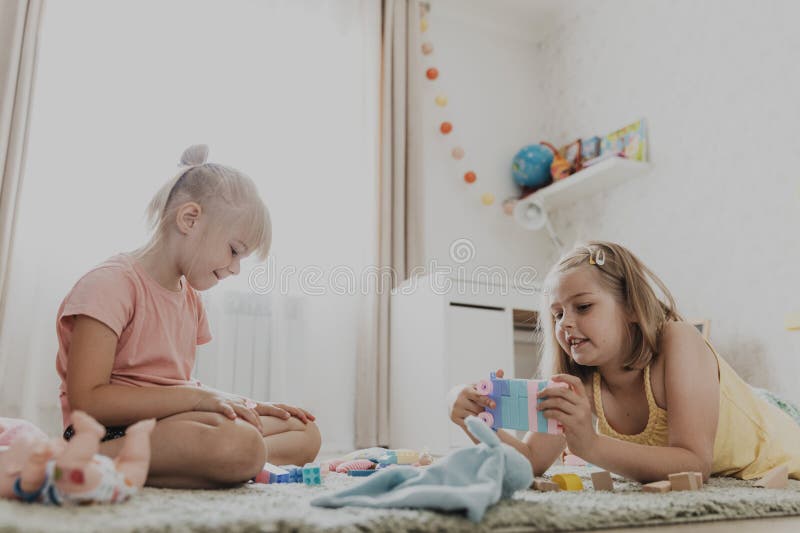 Children Playing with Toy Building Blocks on the Floor at Home or ...