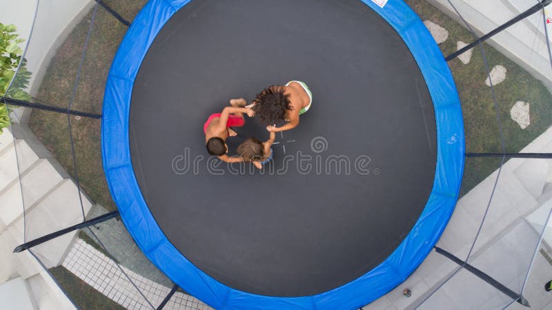 Children Playing on Trampoline Aerial View Stock Image - Image of ...