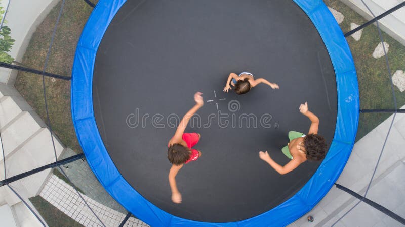 Children Playing on Trampoline Aerial View Stock Image - Image of grass ...