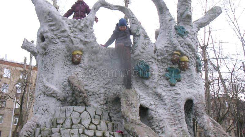 Children Playing on a Tree in Park. Stock Video - Video of children ...