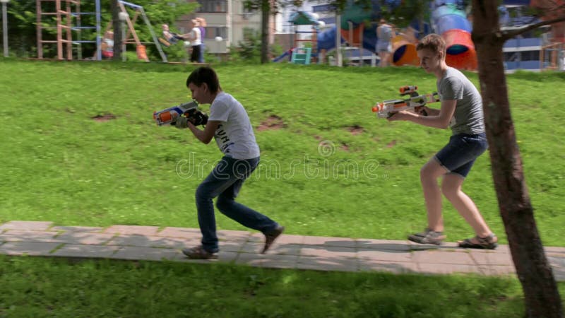 The Children is Playing in the War. Game on Green Grass. Summer ...