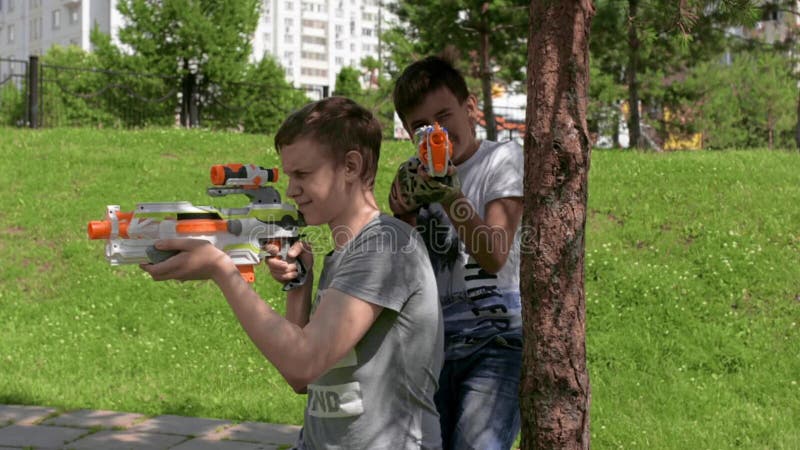 The Children is Playing in the War. Game on Green Grass. Summer ...