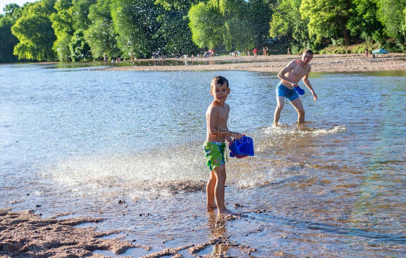 Children Playing in the Water on the River Stock Image - Image of ...