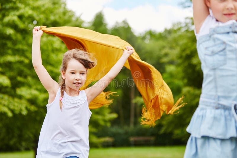 Children Playing with the Wind and Cloth Stock Image - Image of happy ...