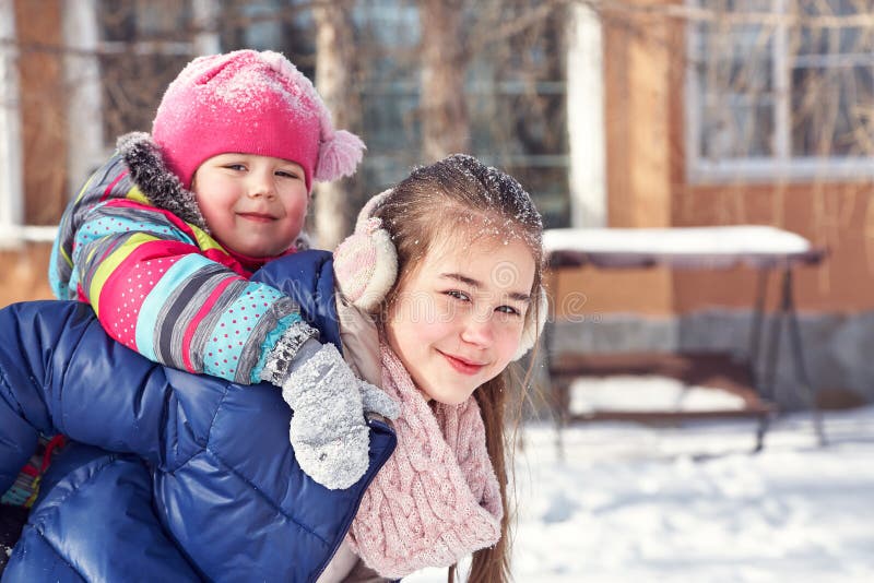 Children Playing in the Yard of His House in the Winter Outdoors Stock ...