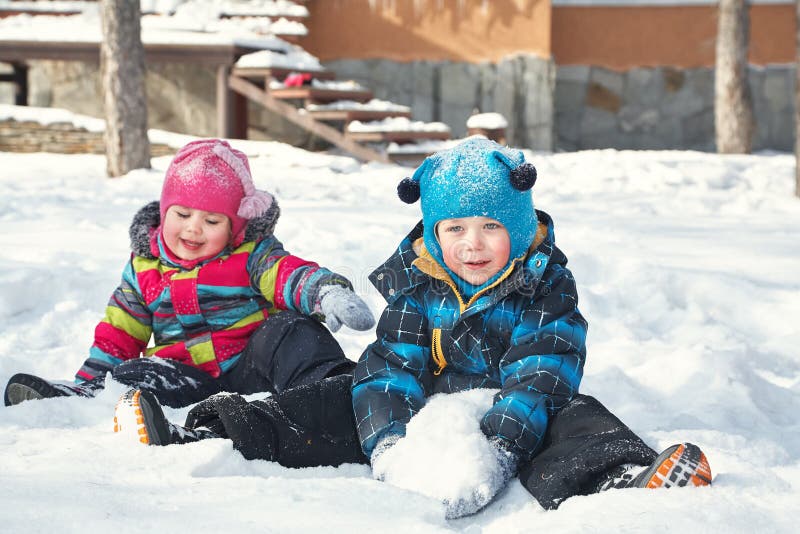 Children Playing in the Yard of His House in the Winter Outdoors Stock ...