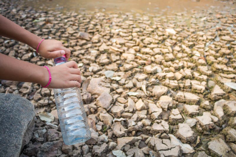 Children Pour Water on the Arid Ground. Stock Photo - Image of light ...
