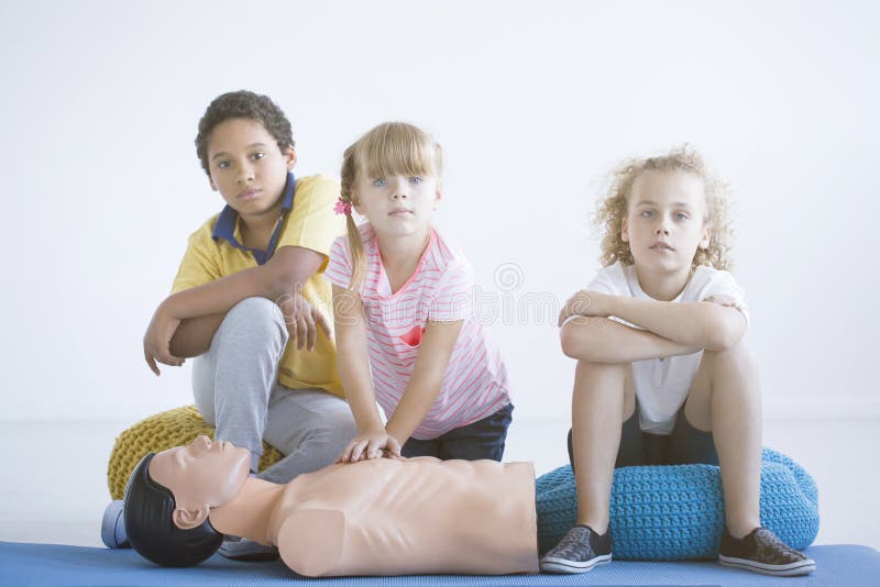 Children Practicing Chest Compressions Stock Photo - Image of kids ...