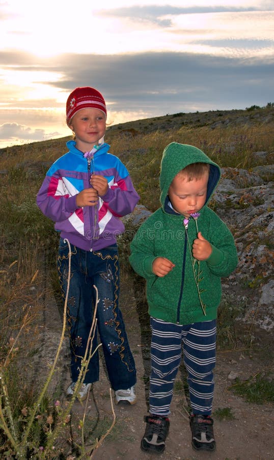 Children in prairie stock photo. Image of evening, examine - 6925066