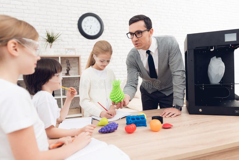 Children Print Different Items on a 3d Printer with a Teacher. Stock ...