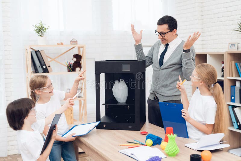 Children Print Different Items on a 3d Printer with a Teacher. Stock ...