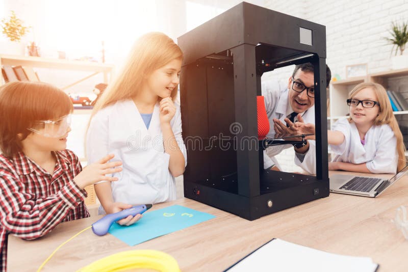 Children Print Different Items on a 3d Printer with a Teacher. Stock ...