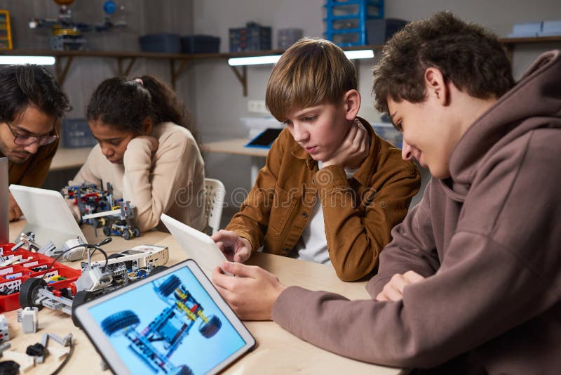 Children Programming Robots in Engineering Class Stock Photo - Image of ...