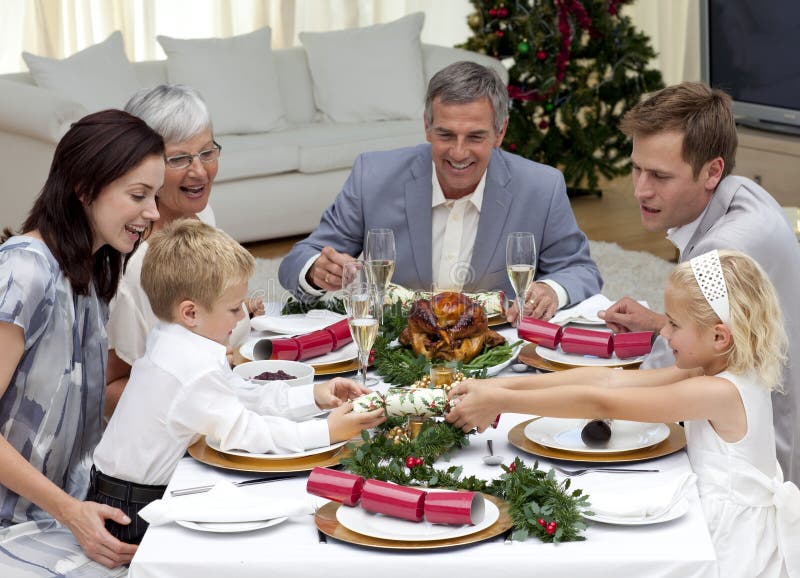 Children Pulling a Christmas Cracker at Home Stock Image - Image of ...