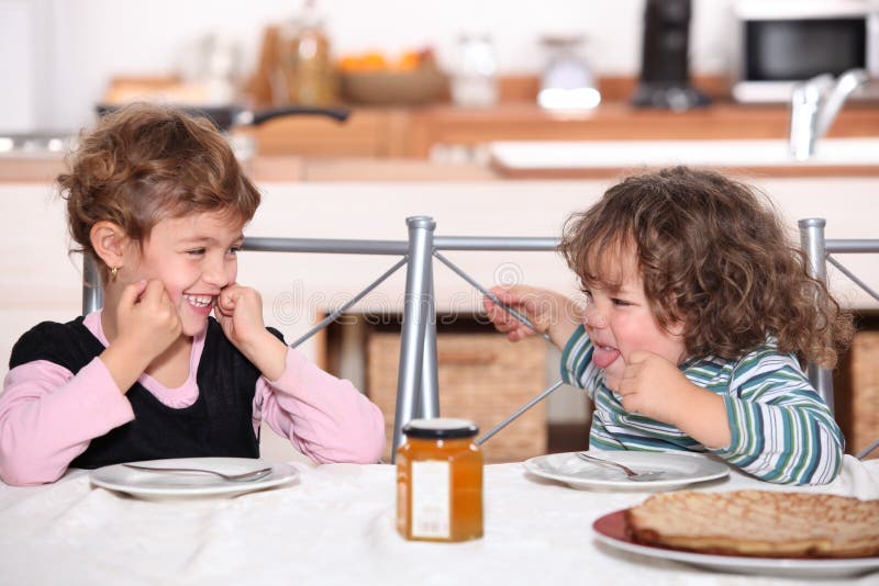 Children Pulling a Christmas Cracker at Home Stock Image - Image of ...