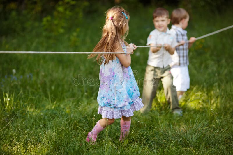 Children Pulling the Rope Outdoors Stock Photo - Image of camp, game ...