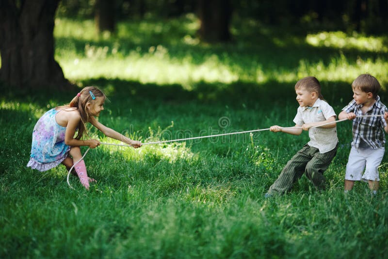Children Pulling the Rope Outdoors Stock Image - Image of casual, happy ...