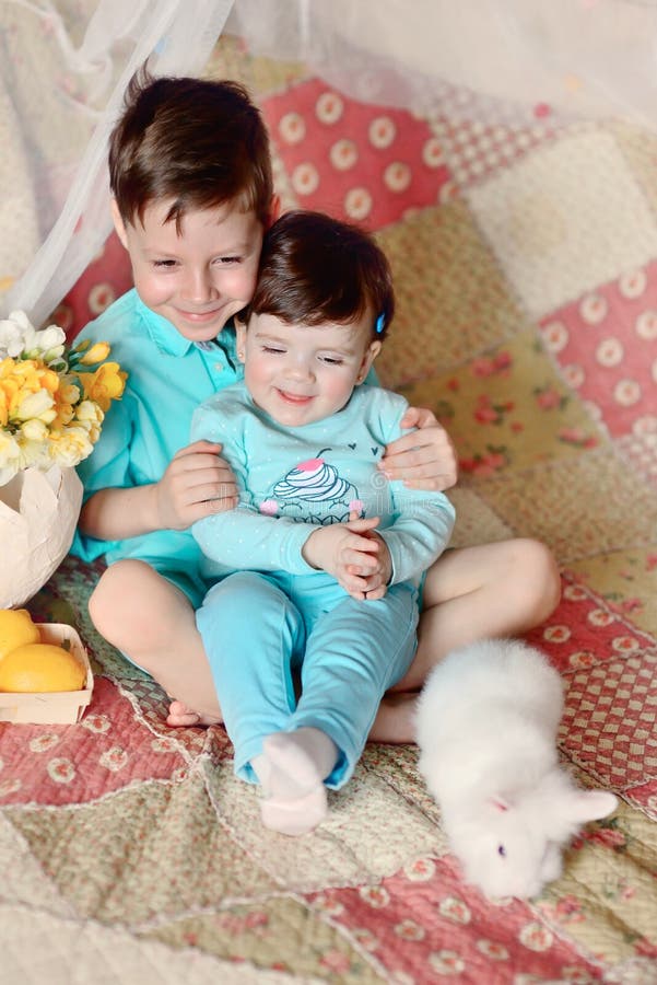 Children and rabbit stock image. Image of indoors, holiday - 39426509