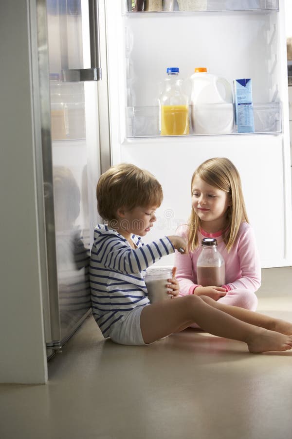 Children Raiding the Fridge Stock Image - Image of siblin, hungry: 54979105