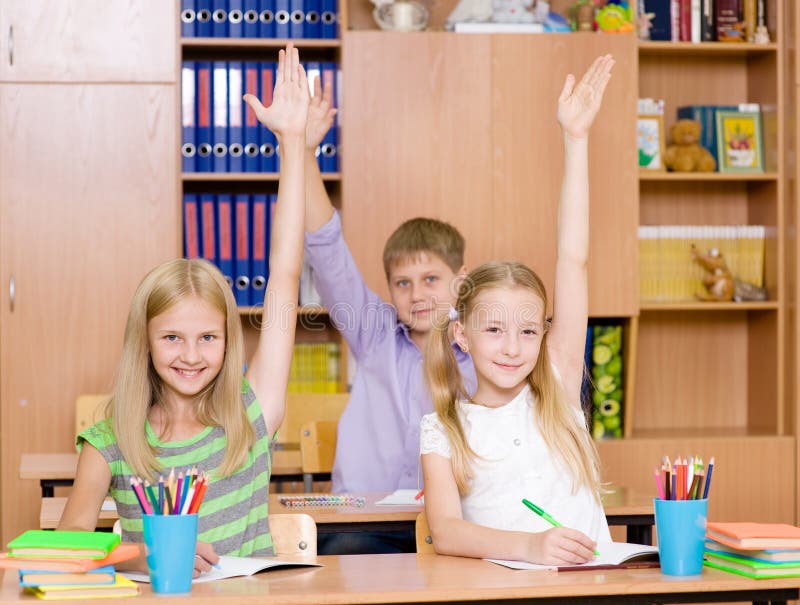Children Raising Hands Knowing the Answer To the Question Stock Photo ...