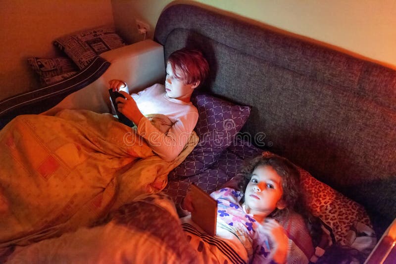 Children Read E-books before Bed Stock Photo - Image of brother ...