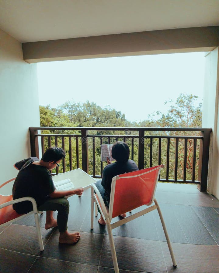 Children Reading at the Balcony while Enjoying the View of the Forest ...