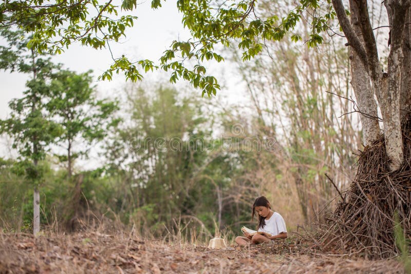 Children reading book stock image. Image of garden, learn - 70900505