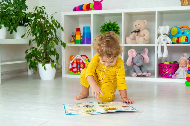 Children are Reading a Book in the Room. Selective Focus Stock Image ...