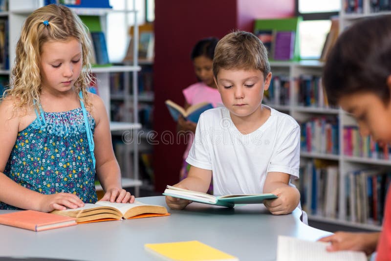 Children reading books stock photo. Image of classmates - 77703118