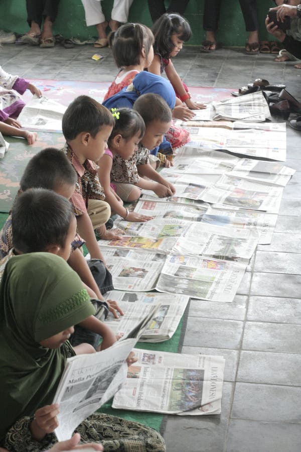 Children Reading a Newspaper on a National Press Editorial Image ...