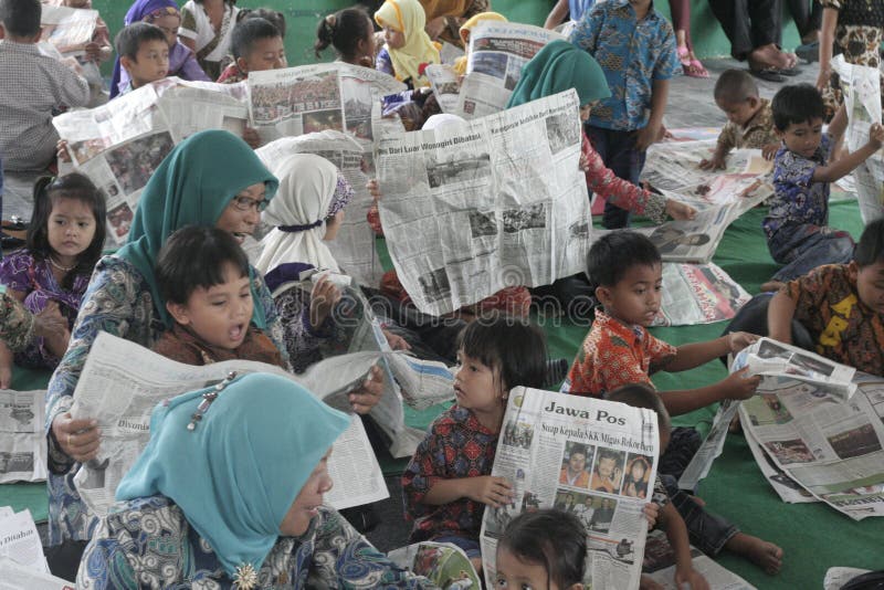 Children Reading a Newspaper on a National Press Editorial Photo ...