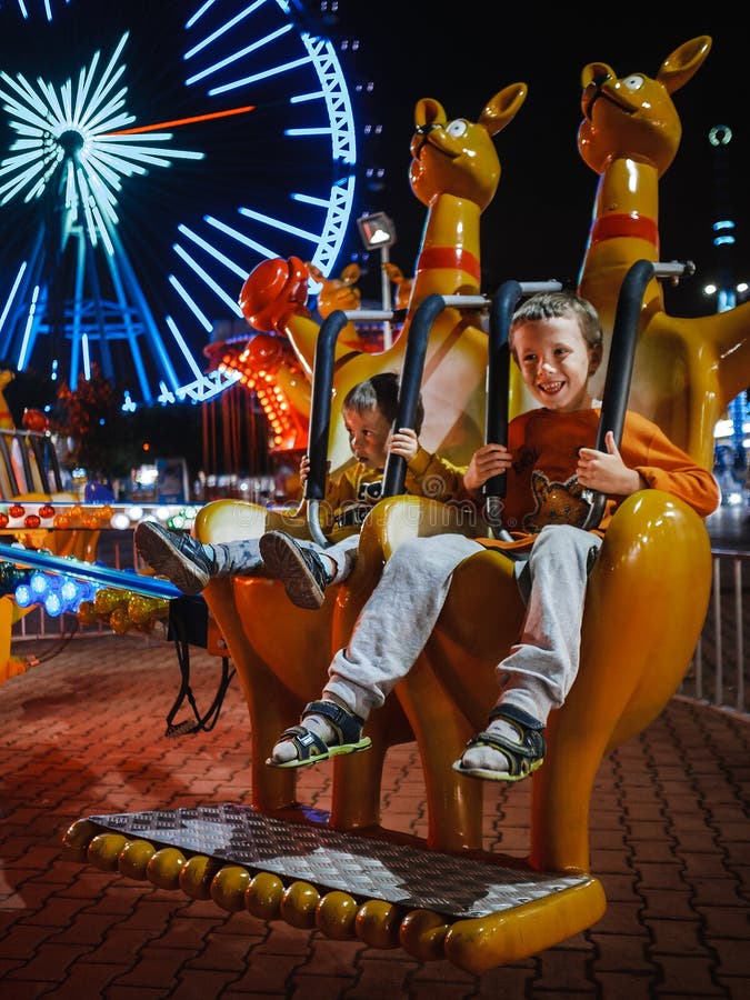Children Ride in an Amusement Park Stock Photo - Image of friendship ...