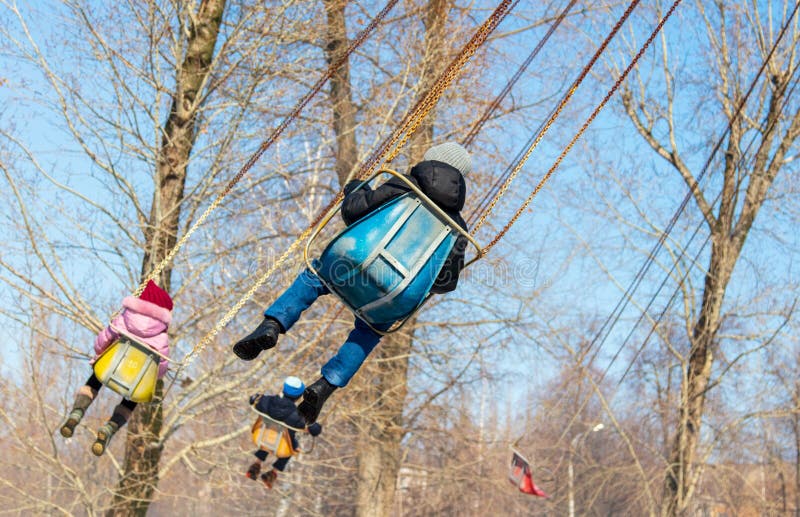 Children Ride on the Carousel in the Park Stock Photo - Image of park ...