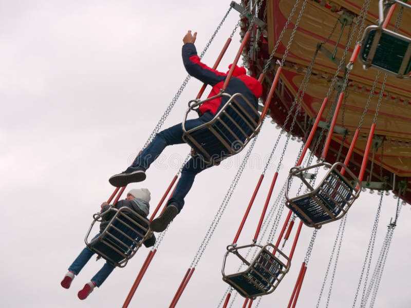 Children Ride on the Merry-go-round in the Fall Stock Photo - Image of ...