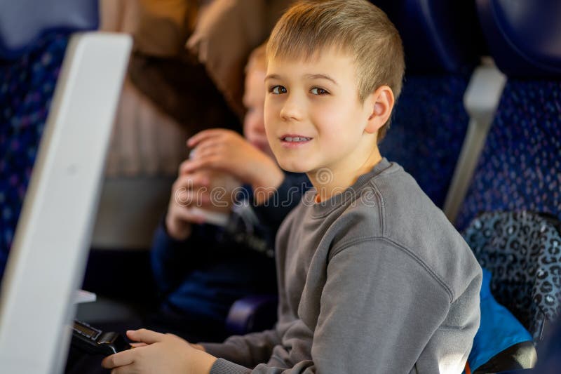 Children Ride in a Passenger Carriage of a Train and Play Games Stock ...