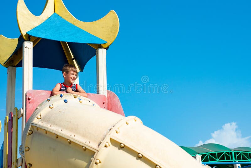 Children Ride on a Children`s Roller Coaster in the Park. Stock Image ...