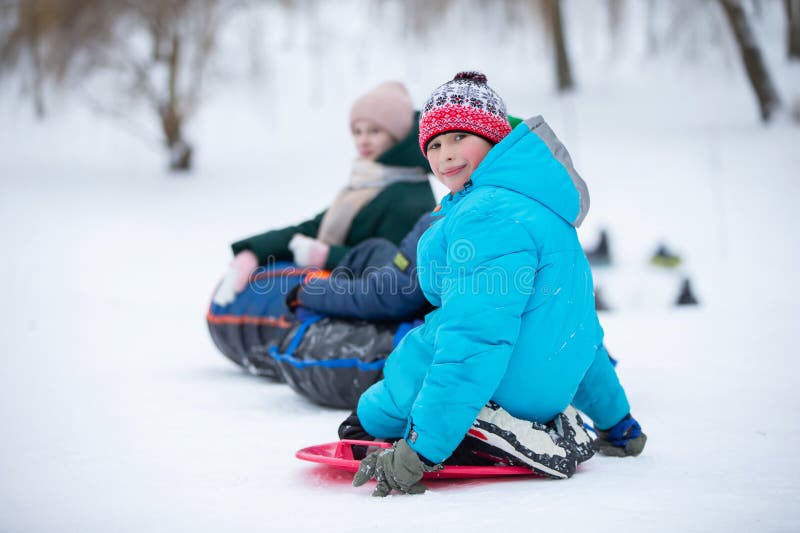 Children ride tubing stock image. Image of childhood - 350230773