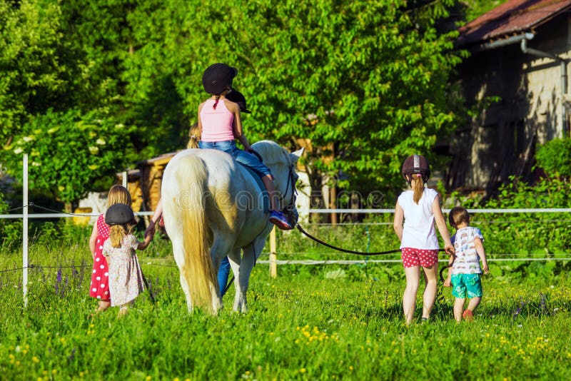 Children riding horse editorial image. Image of happy - 75139010