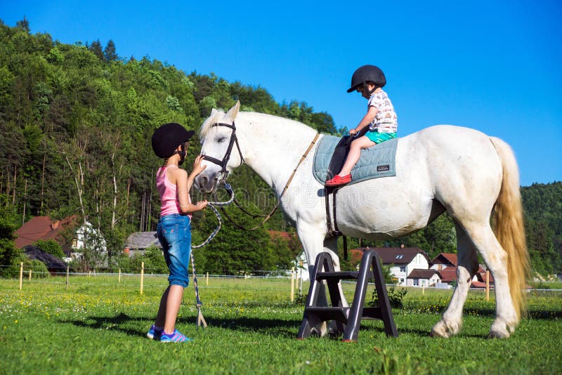 Children riding horse editorial image. Image of rein - 75139825