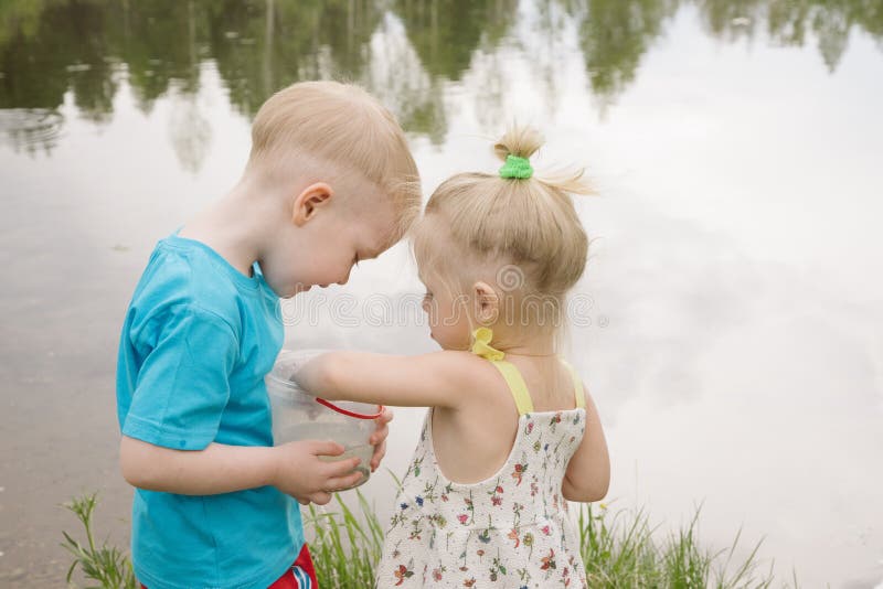 Children on a River in a Forest Catch Fish Stock Photo - Image of ...
