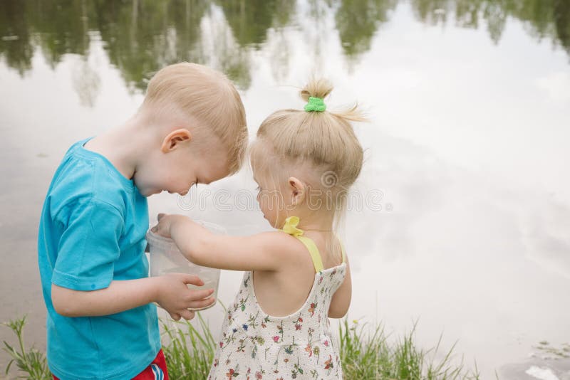 Children On A River In A Forest Catch Fish Stock Image - Image of ...