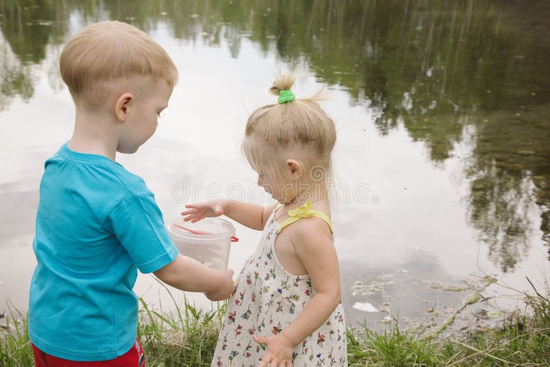 Children on a River in a Forest Catch Fish Stock Photo - Image of ...