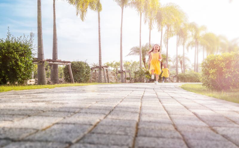 Children Running Along the Path in the Park Stock Photo - Image of ...