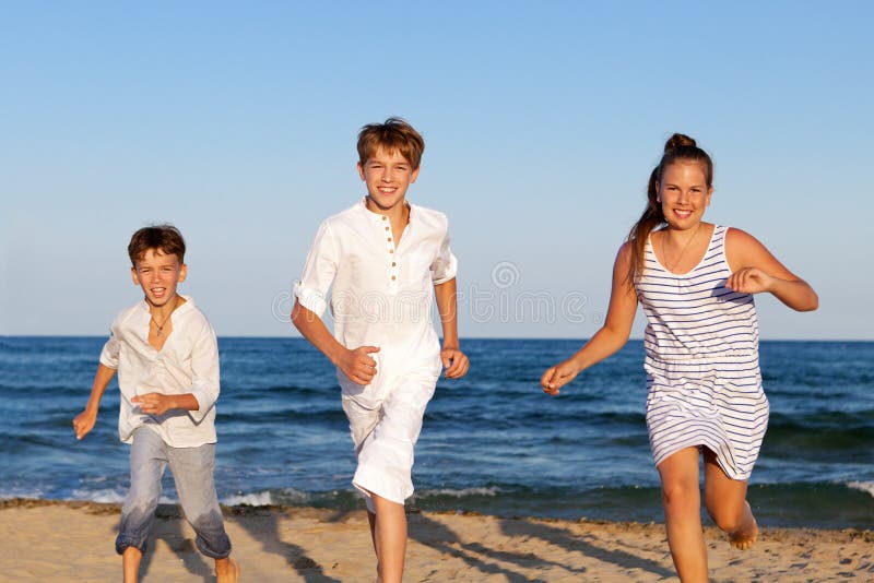 Children are Running on Beach Stock Photo - Image of outdoor, caucasian ...