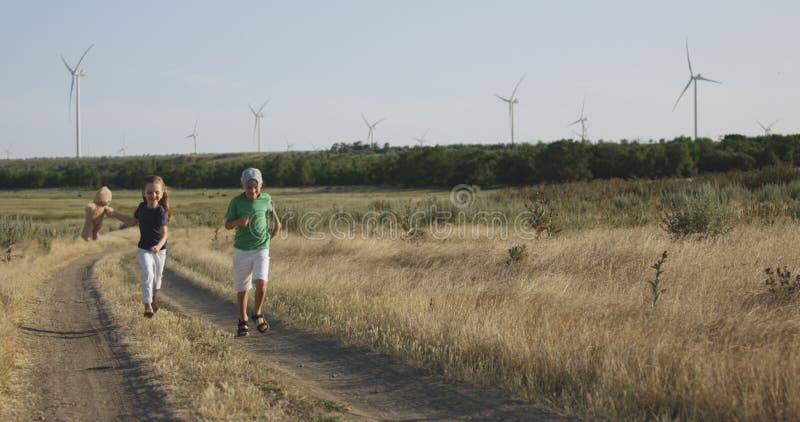 Children Running Over the Camera in Field Stock Image - Image of ...