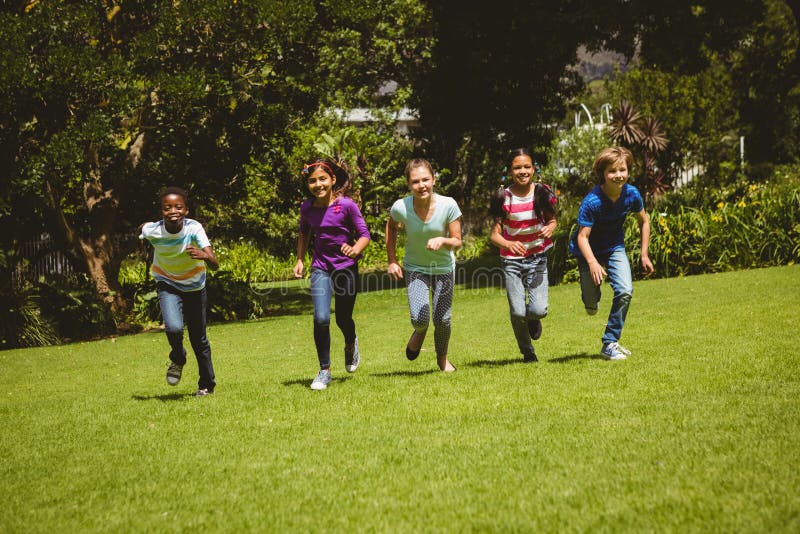 Children running at park stock image. Image of looking - 50485545