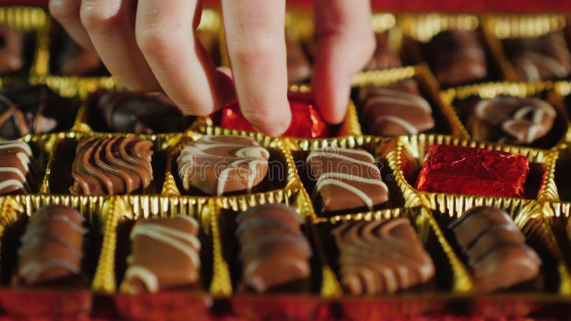 Children`s and Adult Hands Take One Candy from a Box Stock Footage ...