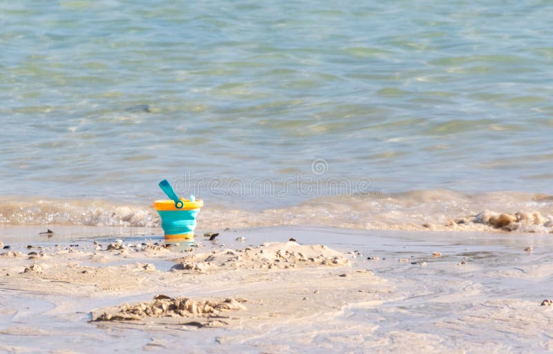Children S Bucket in the Sand on the Seashore Stock Image - Image of ...
