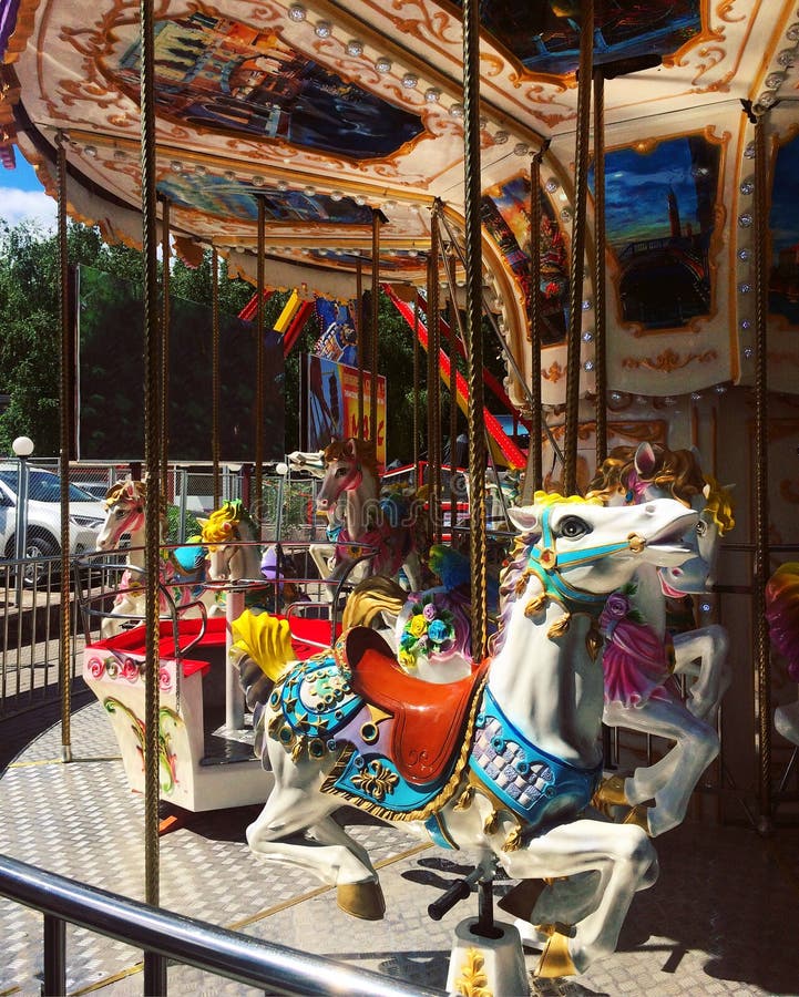 Carousel Horses in the City Editorial Photography - Image of carousel ...
