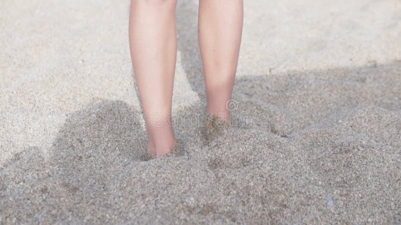Children S Feet are Buried in the Sand Stock Footage - Video of person ...